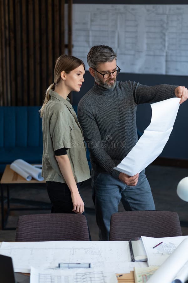 Engineer Team Working in Office with Blueprints and Architect Equipment ...