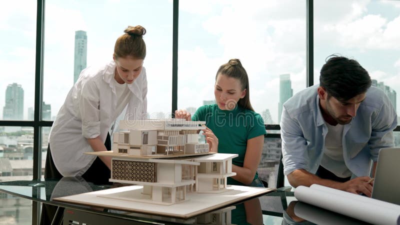 Engineer Team Working Together To Analyze House Model Construction ...