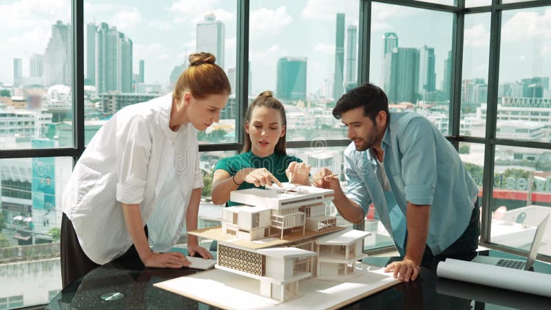 Engineer Team Working Together To Analyze House Model Construction ...