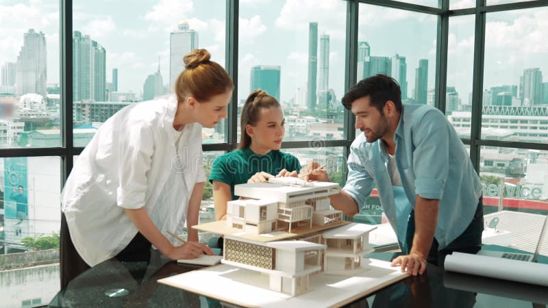 Engineer Team Working Together To Analyze House Model Construction ...