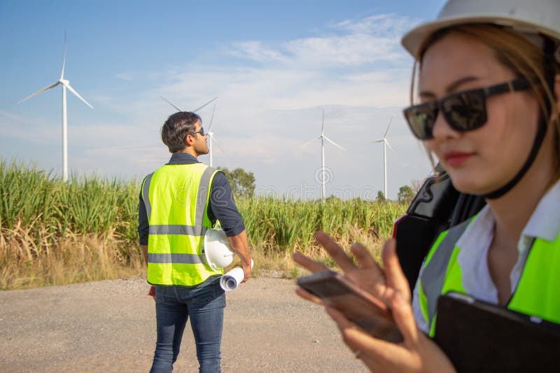 Engineer Team Working in Wind Turbine Farm. Renewable Energy with Wind ...