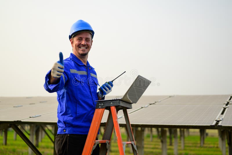 Professional Engineer Maintaining Solar Panels on Solar Cell Farm Stock ...