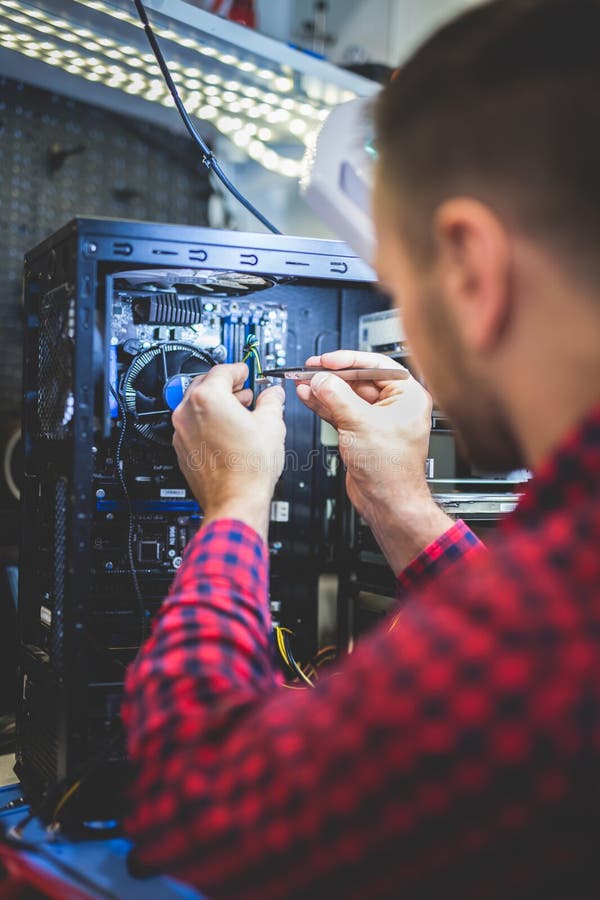 Technician Repairing Inside the Smartphone Motherboard with Tools for ...