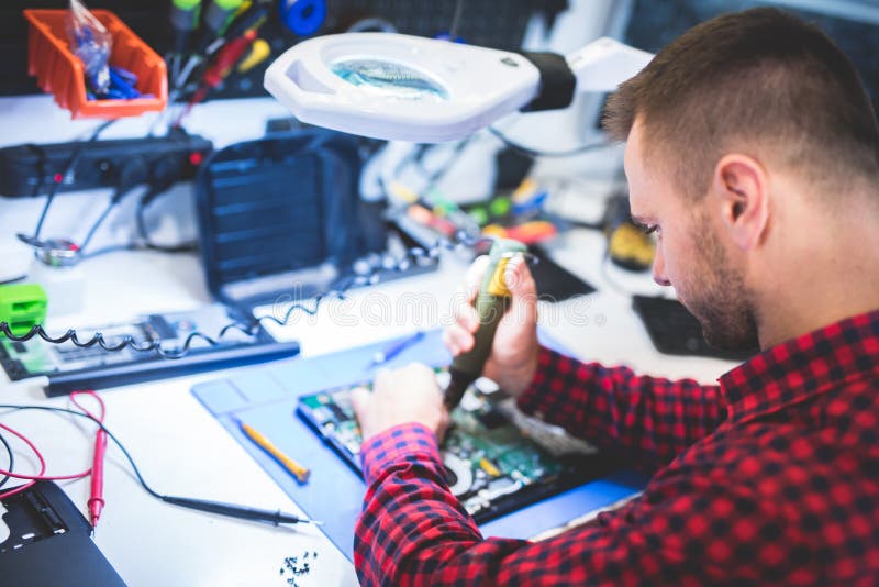 It Engineer Technician Repairing Computer in Electronics Service Shop ...