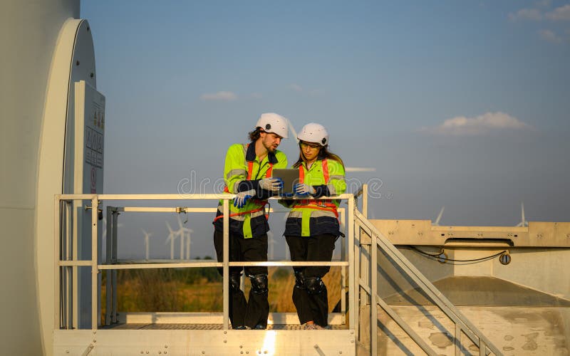 Engineer Technician with Safety Uniform Working at Wind Turbine Field ...