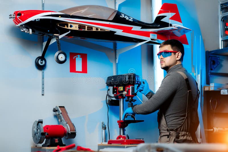 Engineer or Technician Using Drill for Drone Details in Lab. Aircraft ...