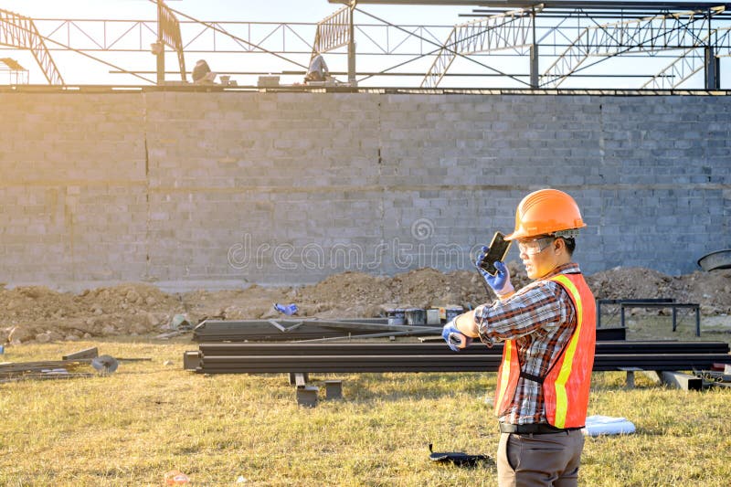 Engineer Technician Watching Team of Workers on High Steel Platform ...