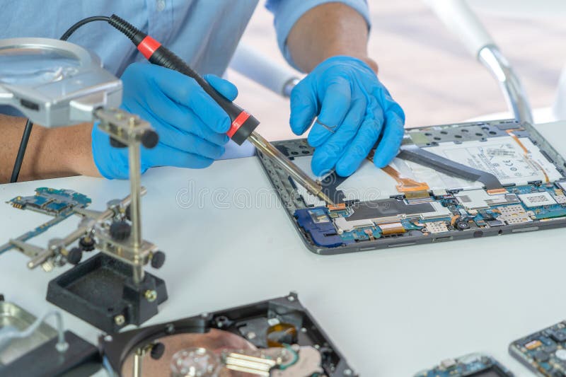 An Engineer or Technician Western Man Working, Examining or Repairing ...