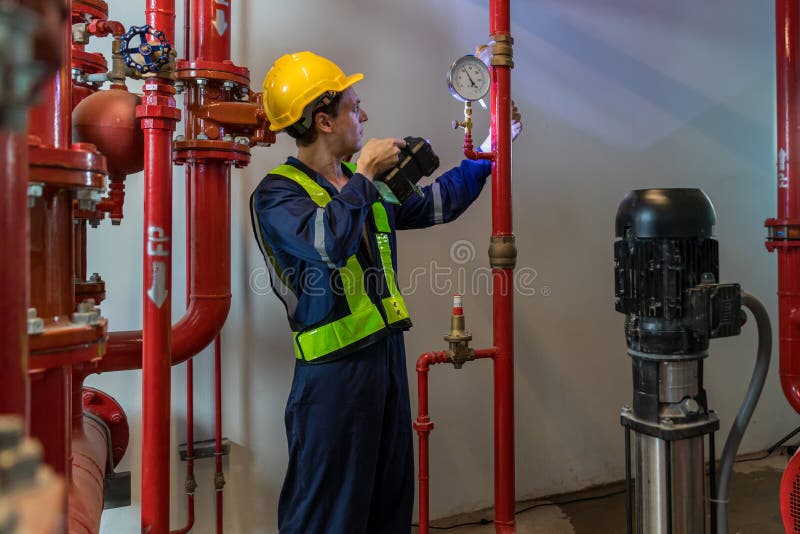 Engineer or Technician Work Checking Fire Suppression System and Fire ...