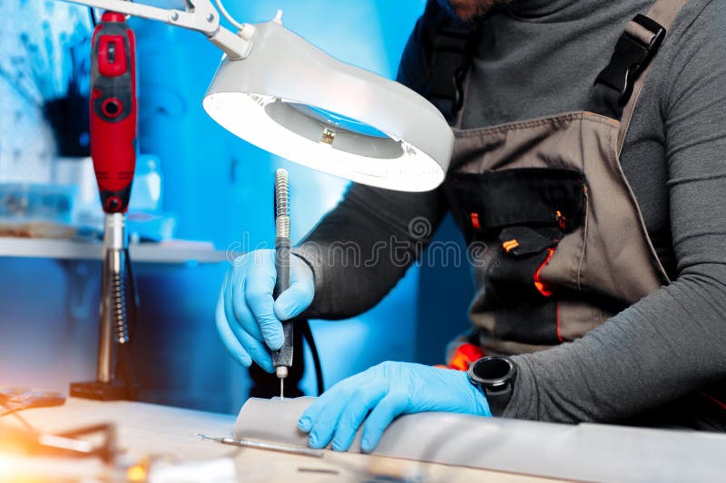 Engineer or Technician Work with Drill on Drone Details in Lab ...