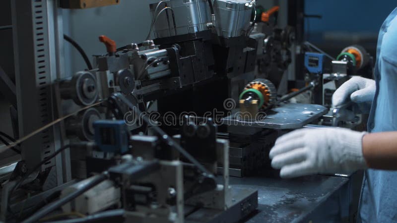 Close Up Engineer Processing Electrical Motor on Automatical Machine at ...