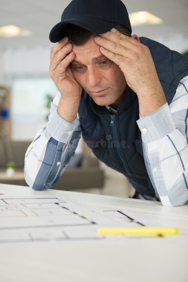 Engineer thinking at table stock photo. Image of work - 289040624