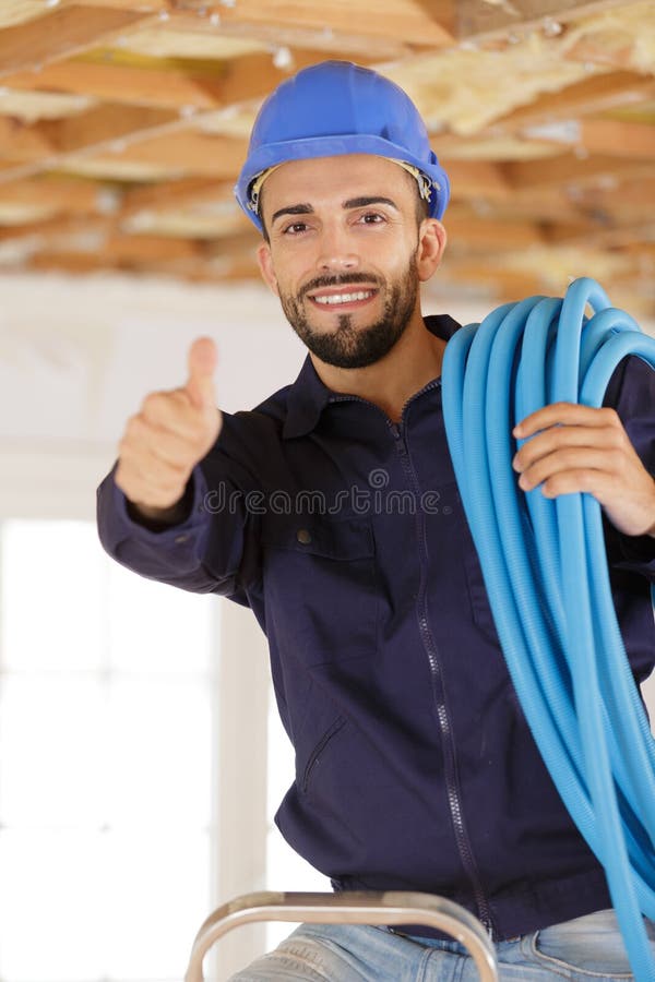 Engineer with thumbs up stock photo. Image of services - 244332752