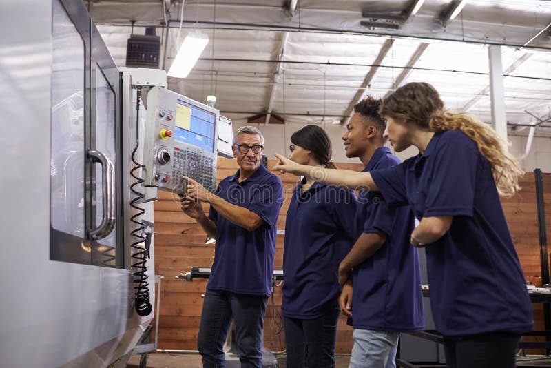 Engineer Training Apprentices on CNC Machine Stock Photo - Image of ...