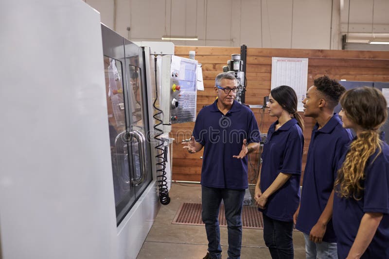 Engineer Training Apprentices on CNC Machine Stock Image - Image of ...