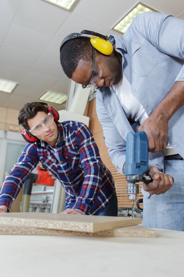 Engineer Training Male Apprentice Using Drill Press Stock Photo - Image ...