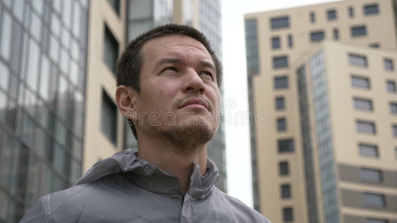 Engineer in Uniform Looking Around with Building on the Background ...