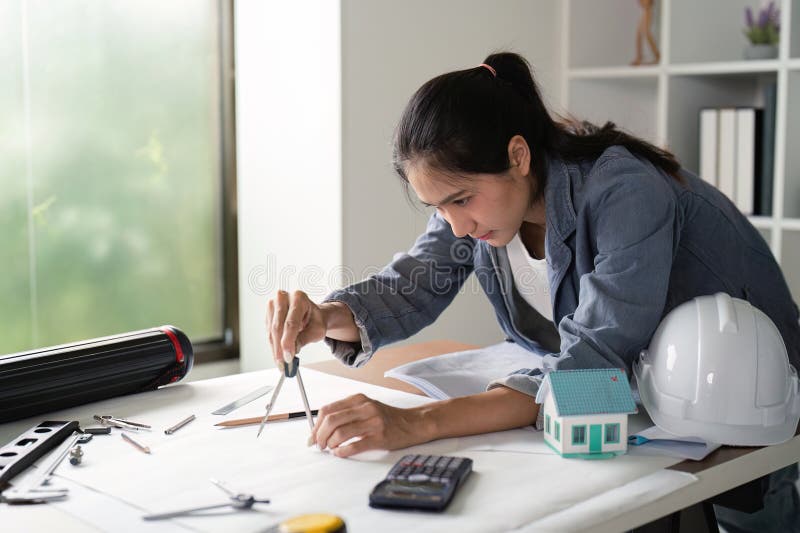Engineer Using Compass for Precise Drafting in Office Stock Image ...