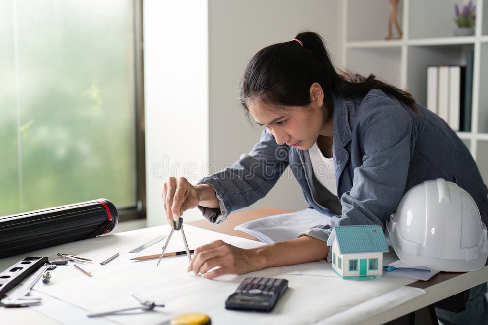 Engineer Using Compass for Precise Drafting in Office Stock Image ...