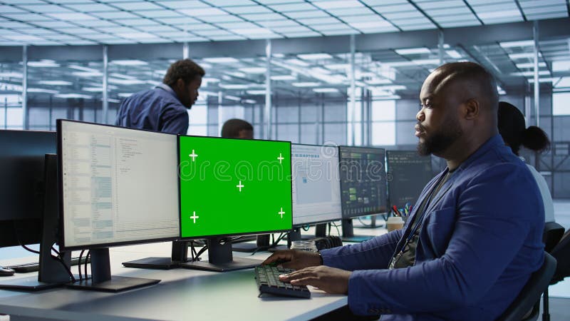 Engineer Using Green Screen Computer, Working in Server Farm Stock Photo - Image of expert ...