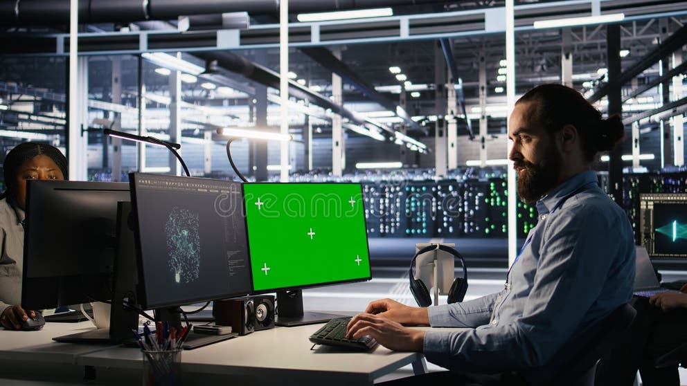 Engineer Using Green Screen Mockup PC in Data Center To Update Servers ...