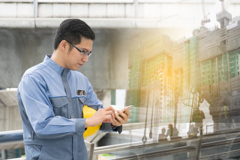 Engineer Using His Smartphone Stock Photo - Image of people, concept ...