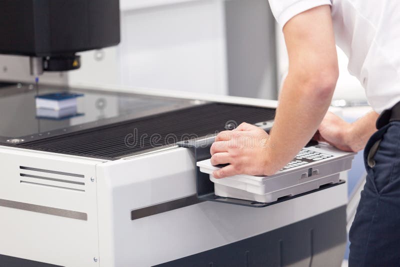 Engineer is Using Keyboard and Joystick To Operate Electronic Device ...