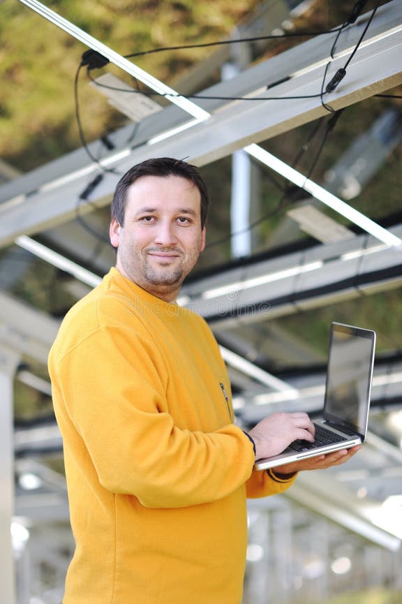 Engineer using laptop stock image. Image of holding, laborers - 23355803