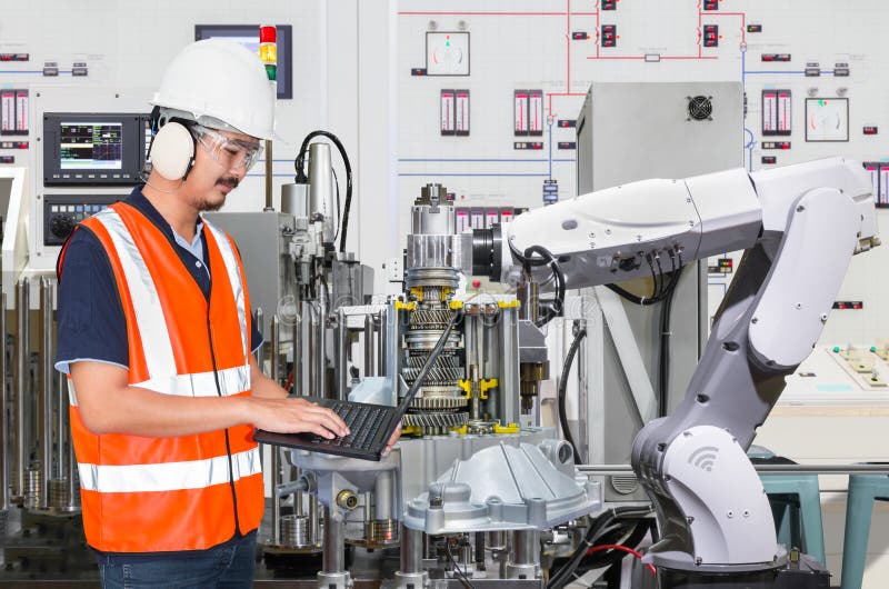 Engineer Using Laptop Computer for Maintenance Automatic Robotic Stock ...