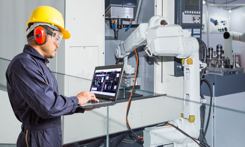 Engineer Using Laptop Computer for Maintenance Automatic Robotic Stock ... Engineer Using Laptop Computer for Maintenance Automatic Robotic Stock ...