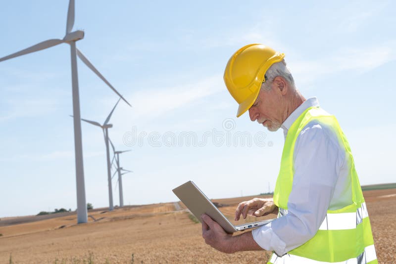 Engineer Using Laptop for Wind Turbine Inspection Stock Image - Image ...