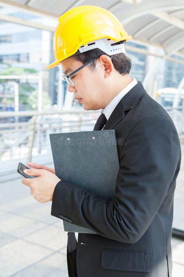 Engineer is Using the Mobile Phone Digital Tablet Stock Photo - Image ...