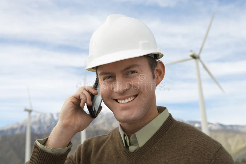 Engineer Using Mobile Phone at Wind Farm Stock Image - Image of ...