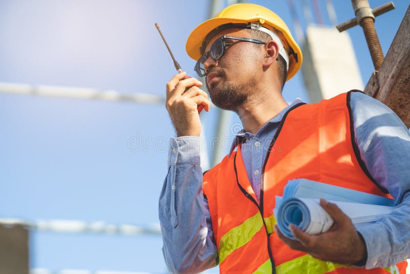 Engineer Using Radio To Command To Labour Team in Site Construction ...