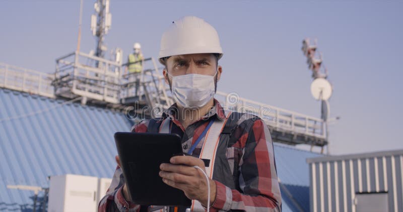 Engineer Using Tablet on a Cellular Tower Stock Image - Image of tablet ...