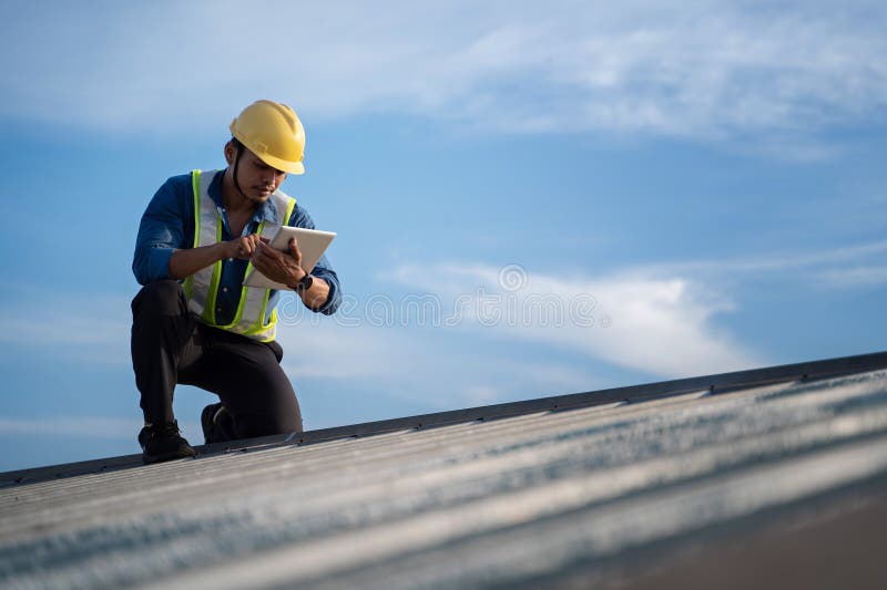 Engineer Using Tablet To Inspect Work at Job Site Stock Image - Image ...