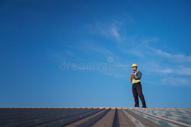 Engineer Using Tablet To Inspect Work at Job Site Stock Photo - Image ...