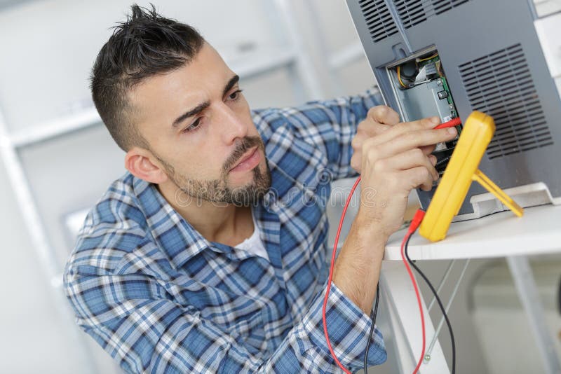 Engineer Using Voltage and Current Tester Stock Photo - Image of people ...