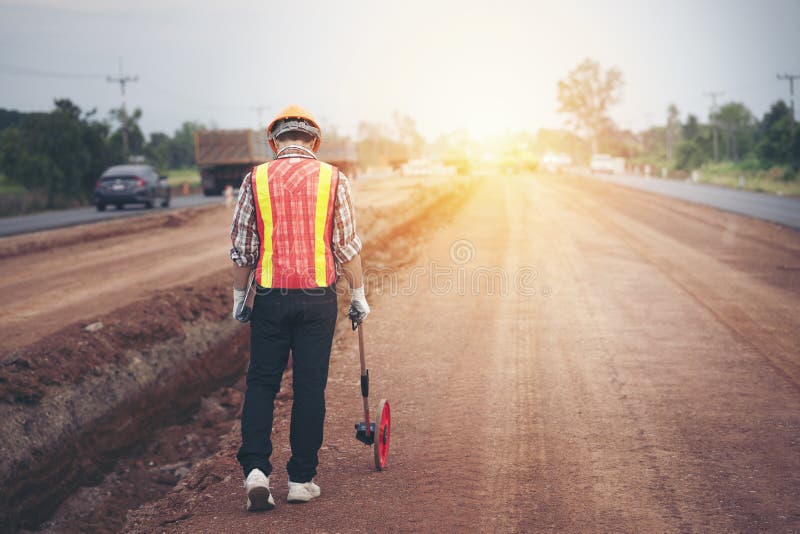 Engineer Walking with the Measuring Wheel Stock Image - Image of ...