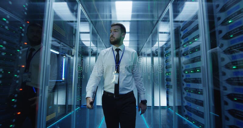 Engineer Walking among Server Racks Stock Photo - Image of intelligence ...