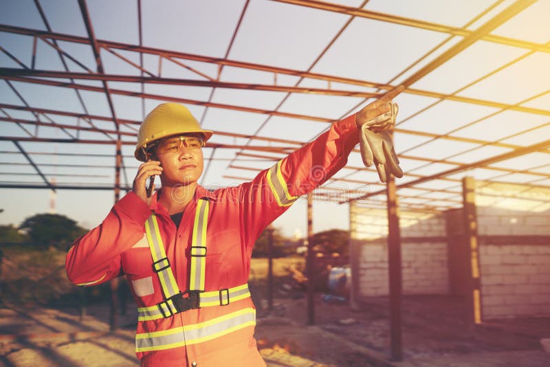 Engineer Wear a Hard Hellmet and Using Smartphone Stock Image - Image ...