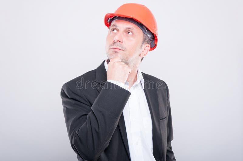 Engineer Wearing Hardhat Making Thinking Gesture Stock Photo - Image of ...