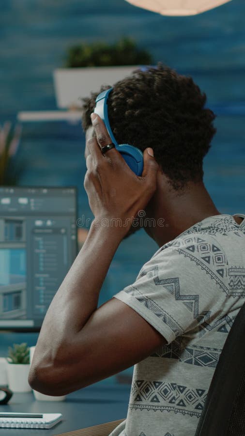 Engineer Wearing Headphones and Designing Building Model Stock Image ...