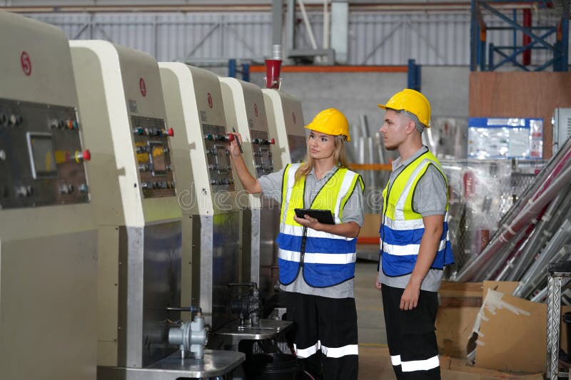 Engineer Wearing Safety Vest Controlling Machine Working Talking with ...