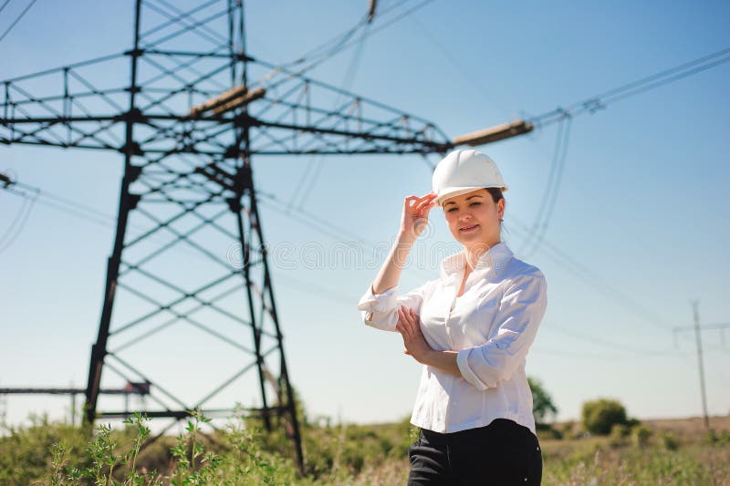 Beautiful Woman Engineer Work at an Electrical Substation. Stock Photo ...