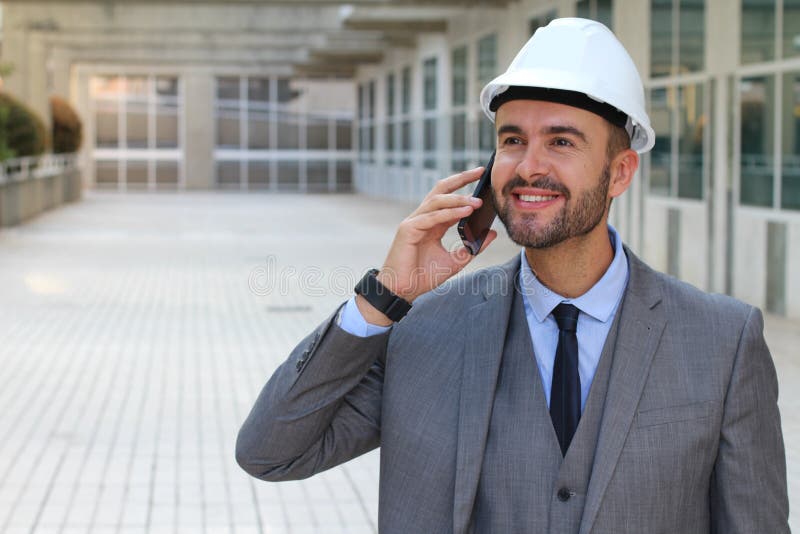 Engineer with White Helmet Calling by Phone Stock Photo - Image of ...