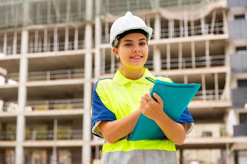 Engineer Woman with Paper Folder in Construction Site Stock Photo ...
