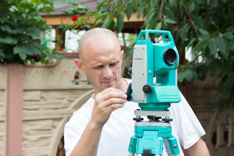 An Engineer at Work with a Total Station Device Stock Photo - Image of ...