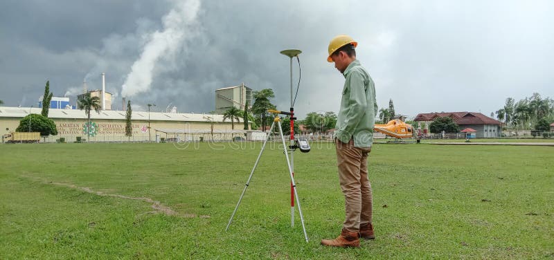 An Engineer at Work Using Gps Editorial Photo - Image of clothing ...
