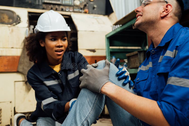 Worker with Accident at Factory, People with Injury from Hard Work in ...